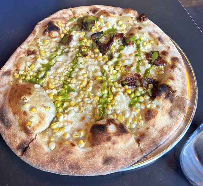 Sweet corn on pizza transforms summer into something you can actually eat, one delicious slice at a time.