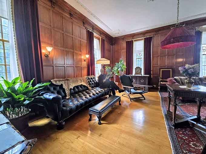 Leather, wood paneling, and a leopard print throw because subtlety was clearly overrated in the 1900s.