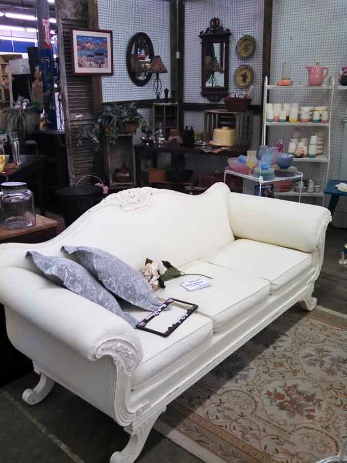 That elegant white couch has seen more dinner parties than most of us have attended.