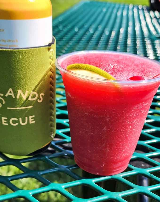 That cherry limeade slushie is the cooling counterpoint your taste buds need after all that smoky richness.