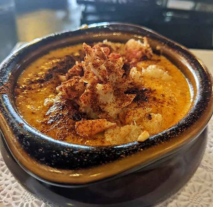 Lobster Bisque topped with perfectly seasoned seafood&mdash;comfort food elevated to an art form, honestly.