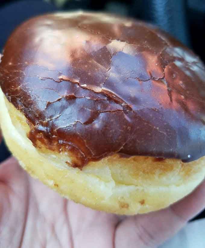 That chocolate glaze has developed the perfect crackle pattern, like a delicious geological formation you can actually eat.