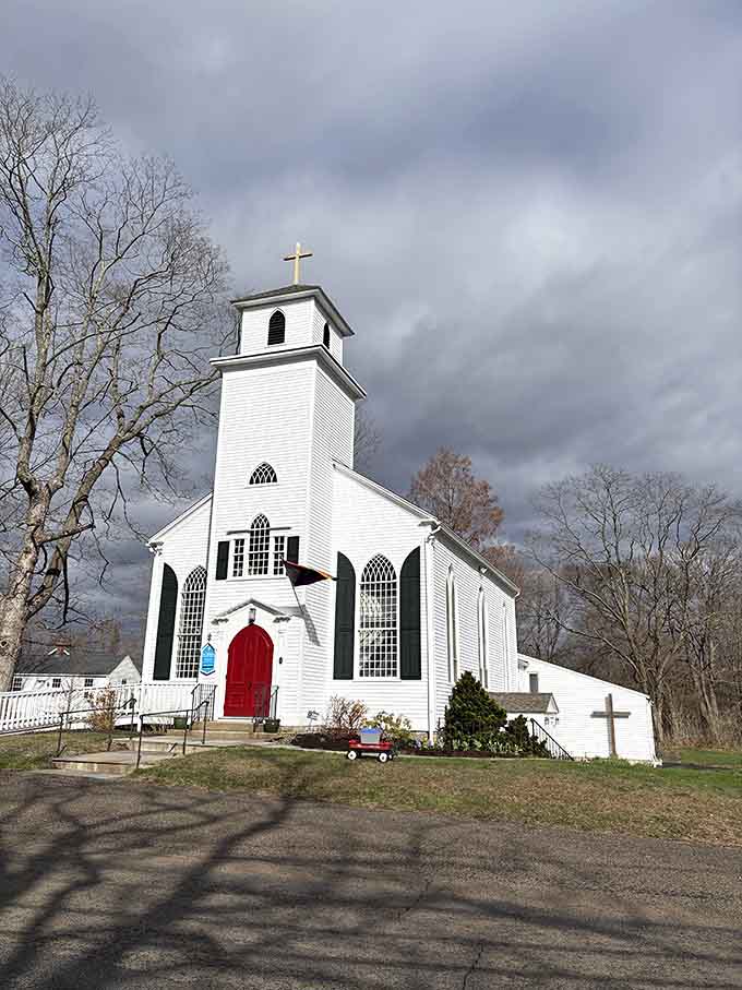 St. John's Episcopal Church sits pretty against dramatic skies, looking exactly like a New England postcard come to life.