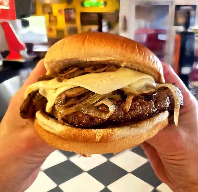 The Mushroom Swiss burger brings earthy sophistication to drive-in dining, like wearing a tuxedo to a barbecue.