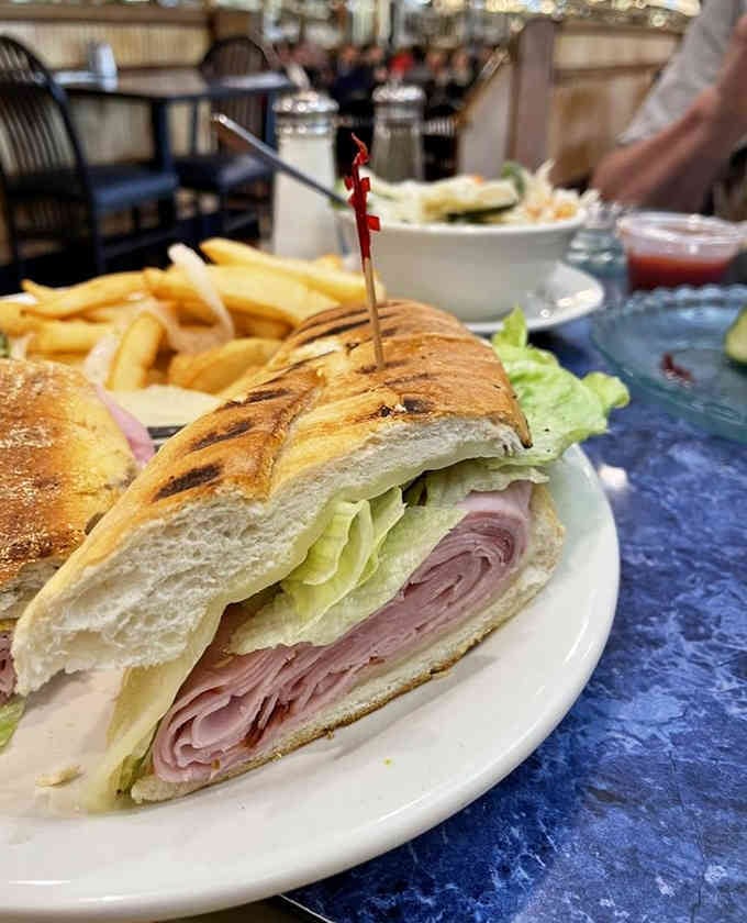 That panini is practically bursting at the seams like it's auditioning for a food commercial.