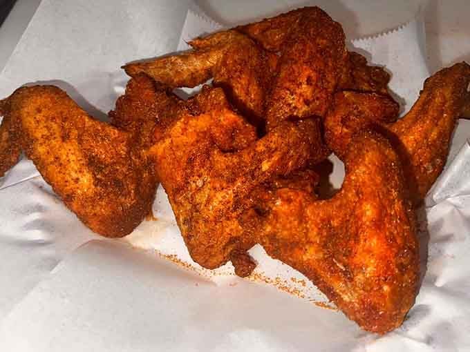 These spicy wings wear their seasoning like a badge of honor, daring you to stop at just one.