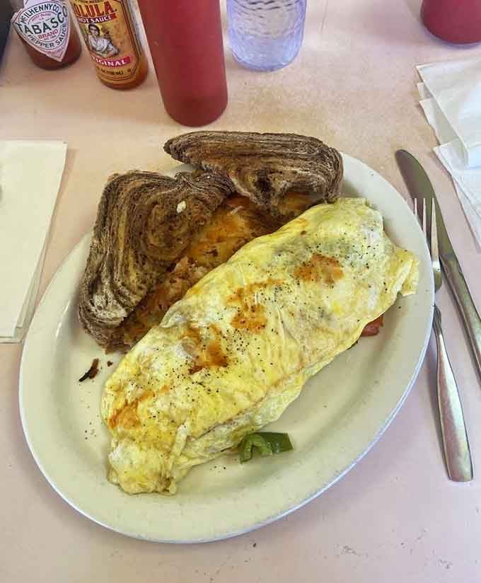 A perfectly folded omelet with rye toast, because sometimes the classics don't need any improvement at all.