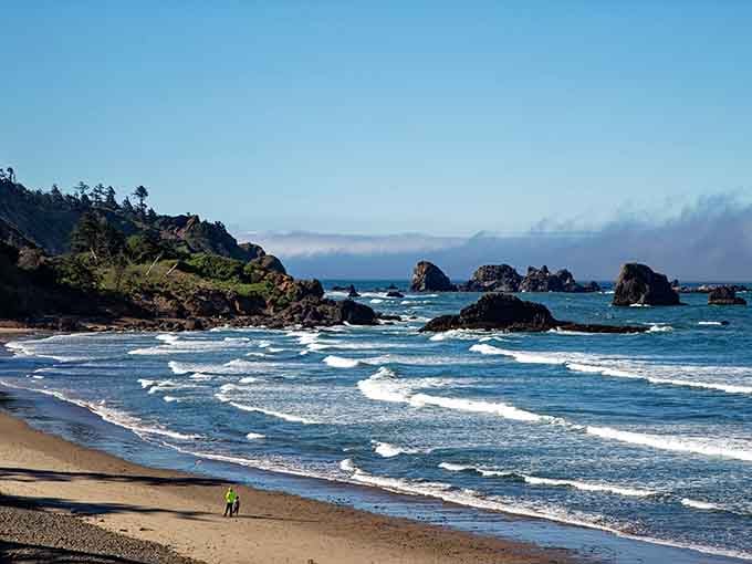 Those rolling whitecaps and scattered rock formations create the kind of scene that belongs on a postcard you'd actually want to receive.