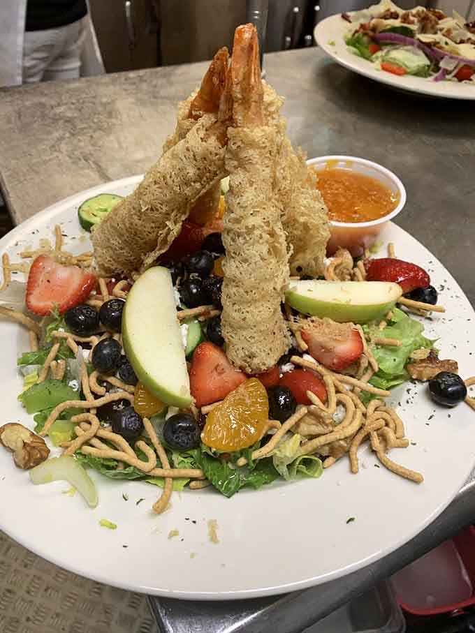 When your salad comes with breaded shrimp standing at attention like soldiers, you know this isn't your average health food.