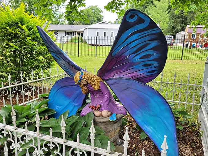 A butterfly fairy rests among the flowers, bringing a touch of delicate magic to balance all those fierce dragons and griffins.