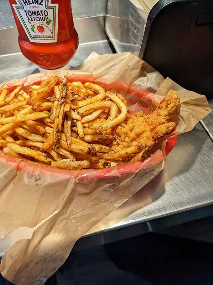 Crispy fried chicken strips paired with golden fries prove that some classics never need reinventing, just appreciating.