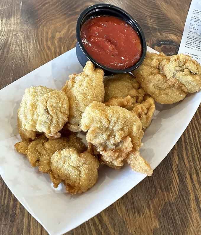 These fried oysters have that ideal golden coating that shatters with each bite, revealing tender treasures inside.