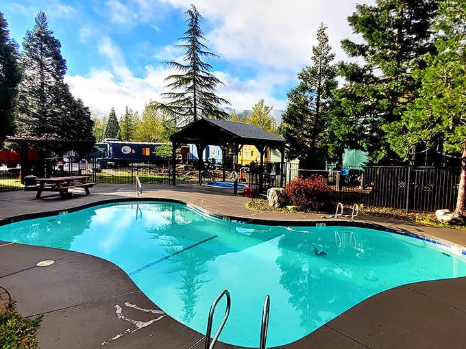 A swimming pool surrounded by mountains and vintage trains might be the most unexpected combination that actually works.