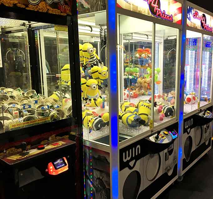 Those Minions stacked behind glass taunt you sweetly, daring your claw machine skills to prove themselves worthy of victory.