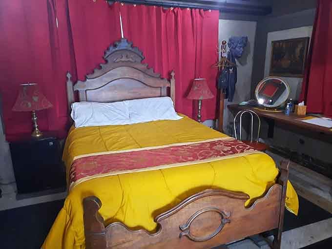Sleep like royalty in this carved wooden bed, where golden linens and ornate headboards make every night feel regal.
