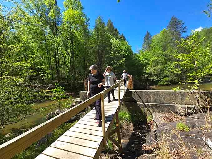Crossing bridges together in the Kentucky wilderness, where the journey matters more than the Instagram photo.