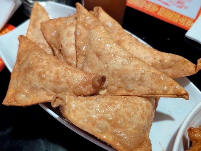 Golden Crab Rangoon triangles deliver that perfect cream cheese-crab combo that somehow never gets old, ever.