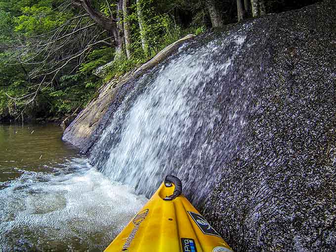 This miniature waterfall from your kayak's perspective looks surprisingly dramatic, like nature's own theme park water feature minus the lines.