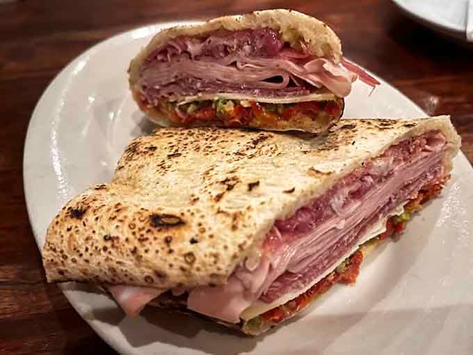 The Polpettine panuozzo: meatballs, cheese, and tomato stuffed into wood-fired bread. Napkins required, regrets impossible.