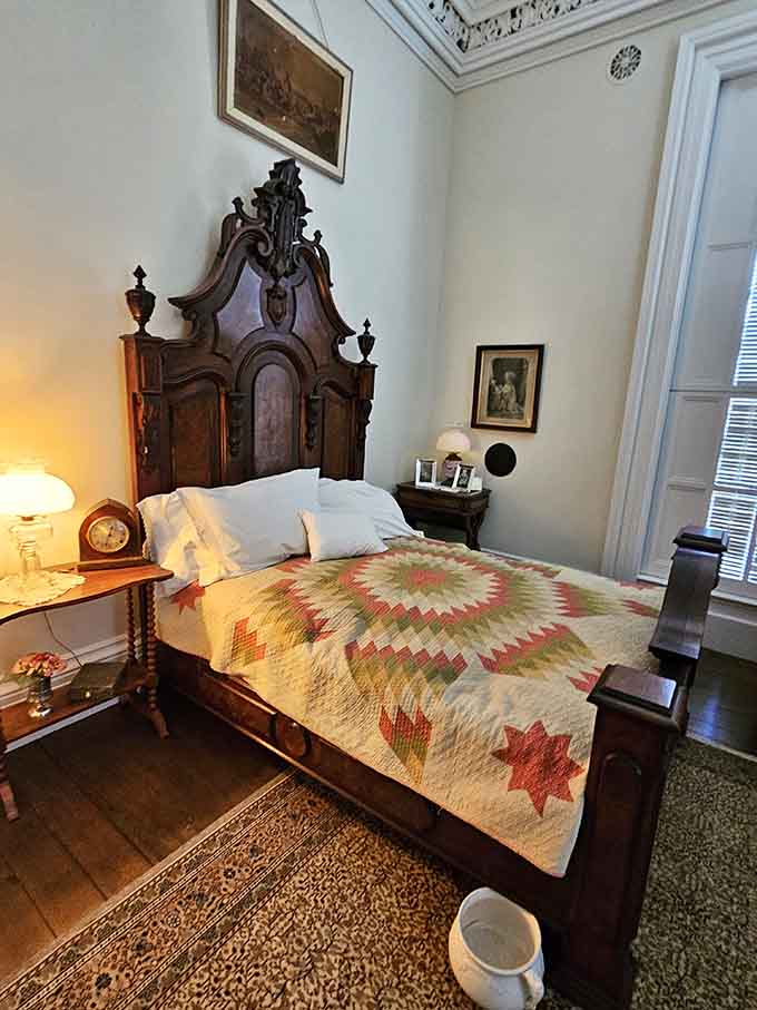 The towering headboard and colorful star quilt in this chamber make modern platform beds look like they're not even trying.