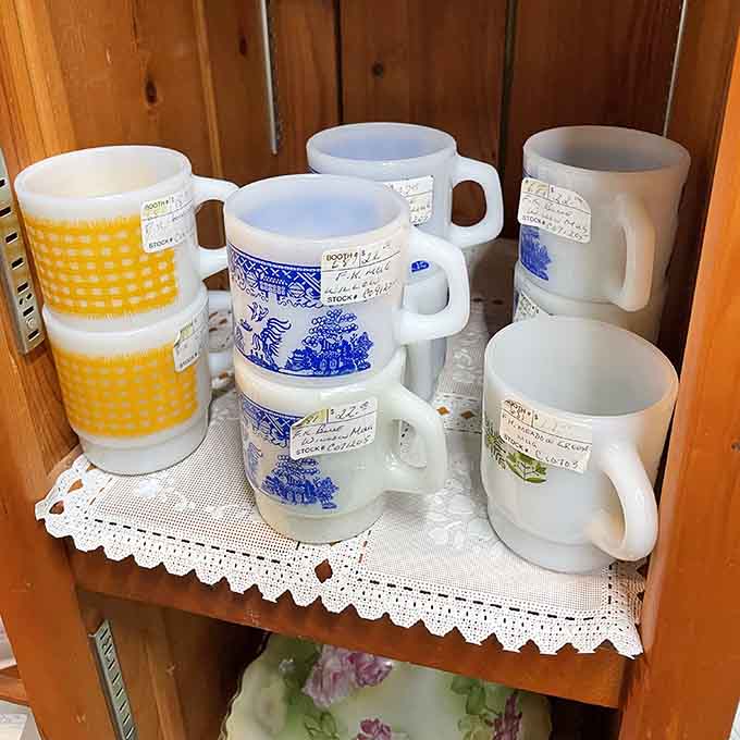 Milk glass mugs in cheerful patterns remind us when coffee breaks involved actual personality and zero paper cups.