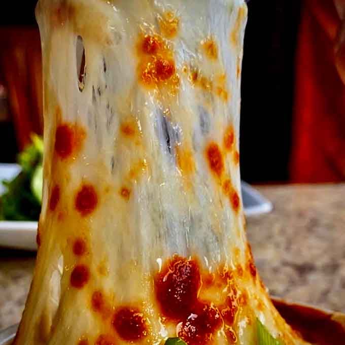 This isn't just French onion soup; it's a molten cheese situation that demands your immediate attention.