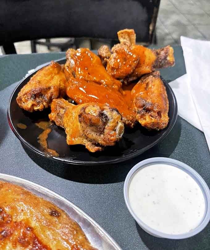 Wings glazed to sticky perfection, the kind that require extra napkins and zero regrets about the mess.