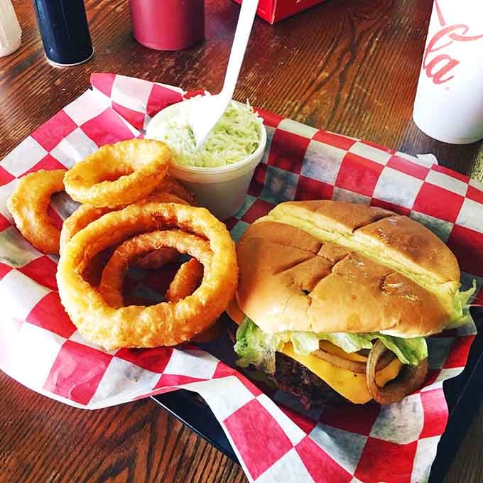 That coleslaw isn't just garnish, it's the refreshing counterpoint to burger and onion ring perfection you didn't know you needed.