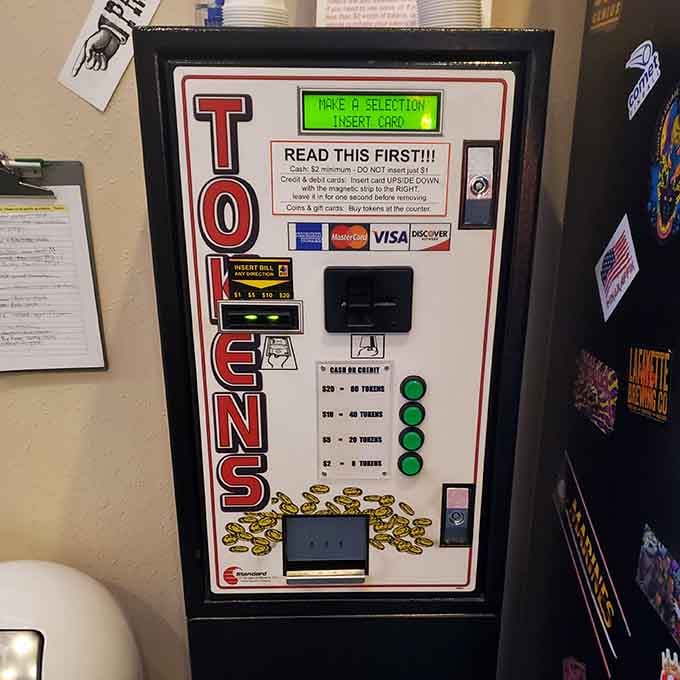 The token machine stands ready to transform your dollars into pure joy, one credit at a time.
