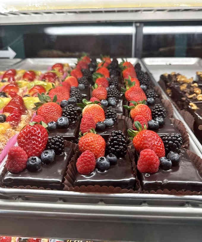 Chocolate rectangles topped with berries that look almost too gorgeous to devour. Almost being the key word.