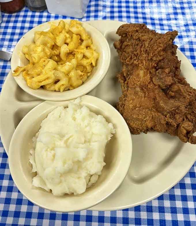 Mashed potatoes, mac and cheese, and fried chicken. The holy trinity of comfort food assembled beautifully.