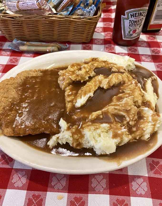 Veal cutlet and creamy mashed potatoes swimming in gravy, because sometimes comfort food is the only answer needed.