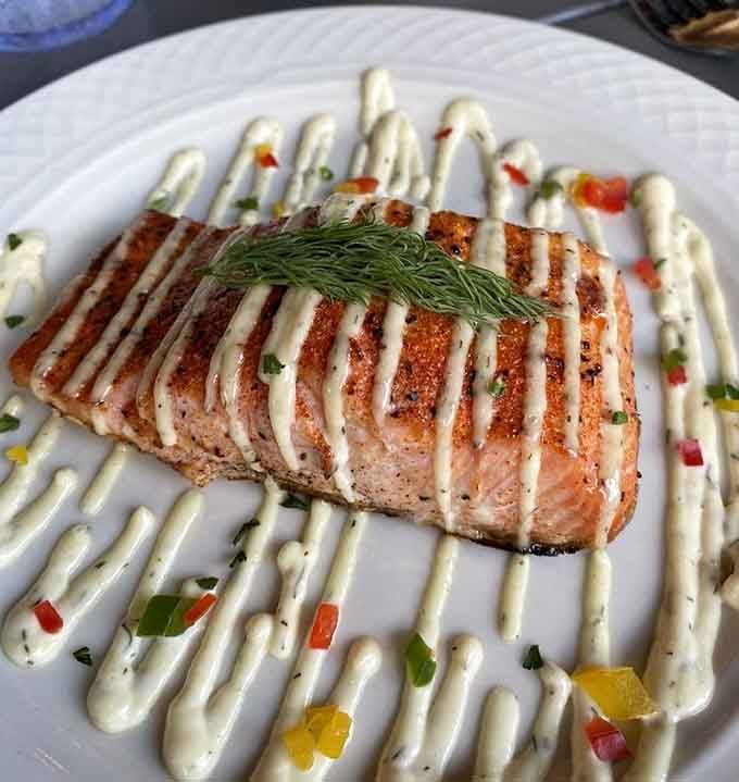 That salmon's sear and artistic drizzle suggest the kitchen takes presentation as seriously as flavor, and both are exceptional.