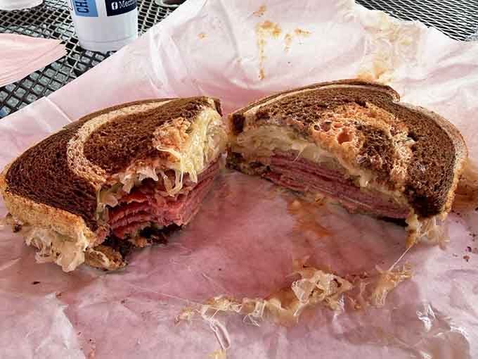 That Reuben's got layers of corned beef, sauerkraut, and melted cheese creating pure deli magic.