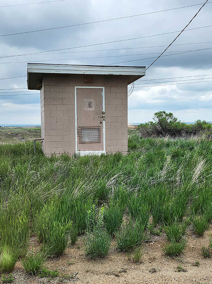 Small utility buildings dot the landscape, remnants of when this site had a much more serious purpose.