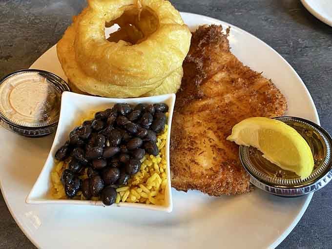 That coconut haddock with black beans and an onion ring tower is comfort food elevated to an art form.