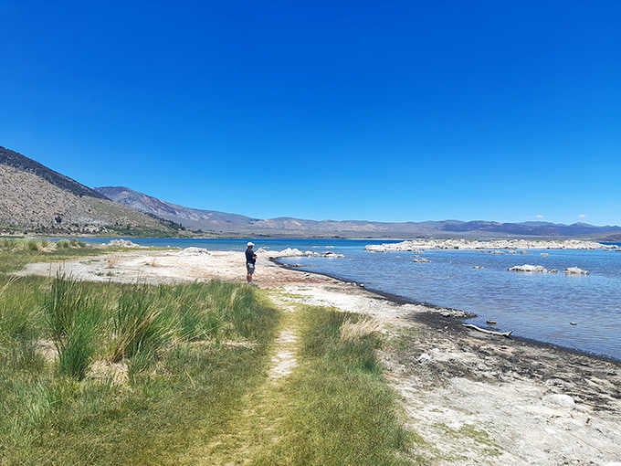 The shoreline trail offers easy access to this geological wonderland, perfect for all fitness levels.