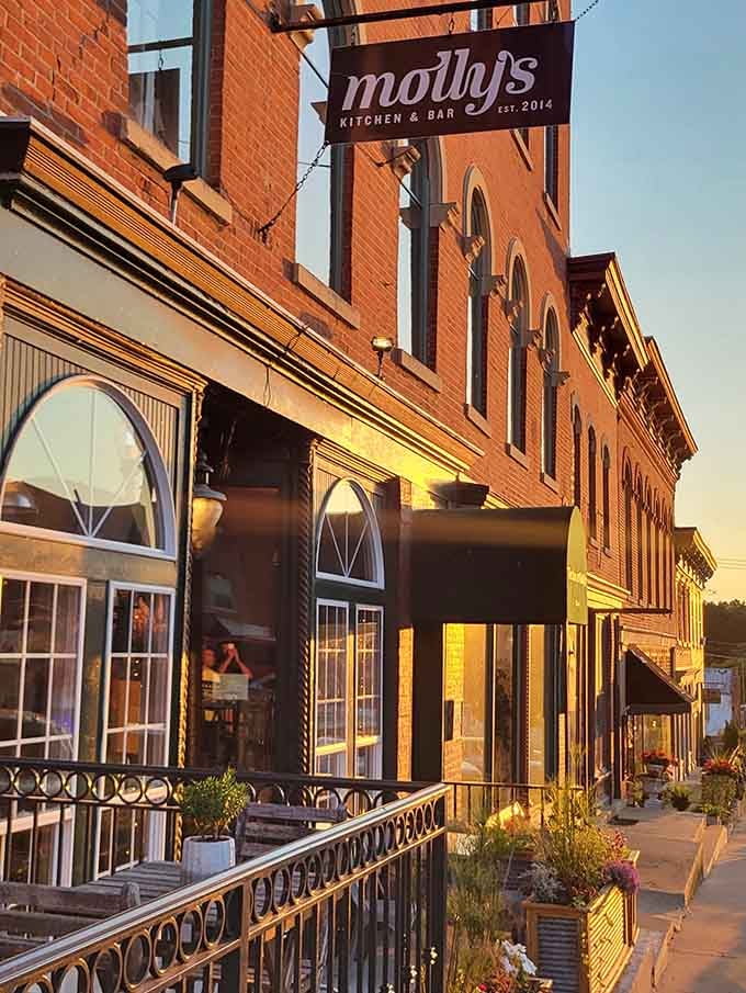 Golden hour hitting those arched windows just right, turning dinner into an Instagram moment before Instagram existed.