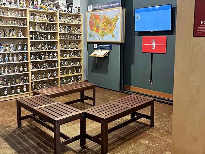 Wooden benches invite you to sit and contemplate the sheer magnitude of bobblehead diversity surrounding you from every angle.