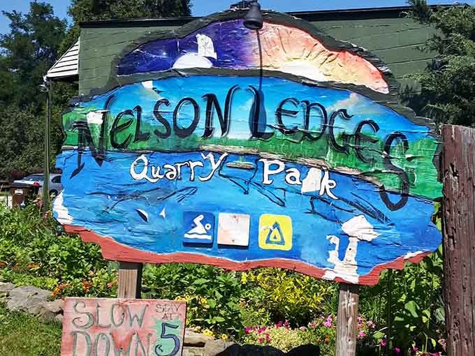 The hand-painted welcome sign captures the laid-back spirit that makes this place feel like a well-kept secret.