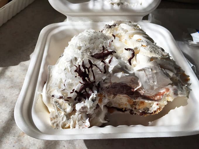 Coconut Mounds pie piled so high it's practically defying the laws of dessert physics.