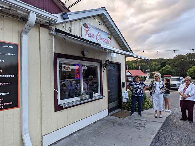 Folks line up for sweet treats at this cheerful spot where ice cream solves problems better than therapy ever could.