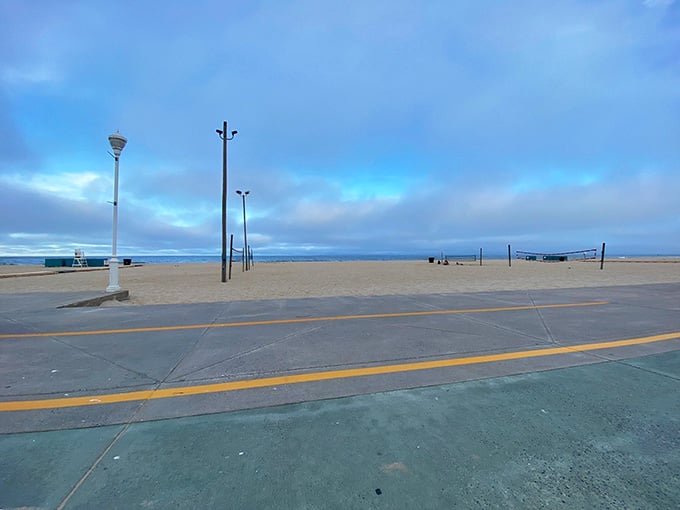 The beach sits empty and moody, like a teenager who just discovered existential philosophy and really good coffee.