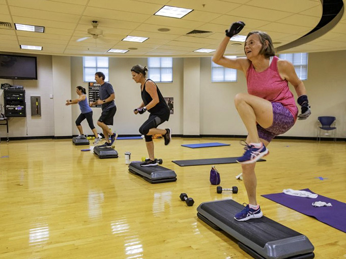 Group fitness classes where the only thing more contagious than the energy is the laughter between sets.