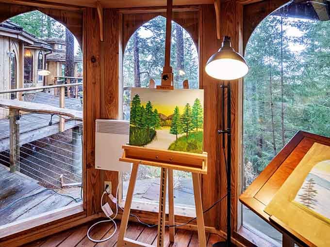 Nothing says "creative retreat" quite like an easel positioned perfectly to capture the forest light streaming through arched windows.