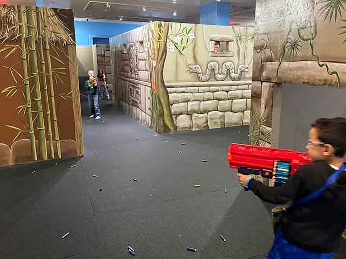 Ancient temple ruins provide dramatic cover as young soldiers navigate the arena, Indiana Jones style but significantly safer and more colorful.