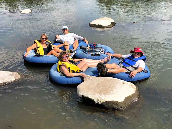 The family that floats together stays together, linked up like a human chain of pure summer contentment.