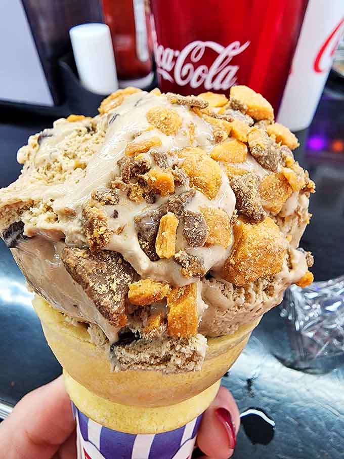 Ice cream piled high enough to require architectural engineering skills and a napkin strategy before your first bite.