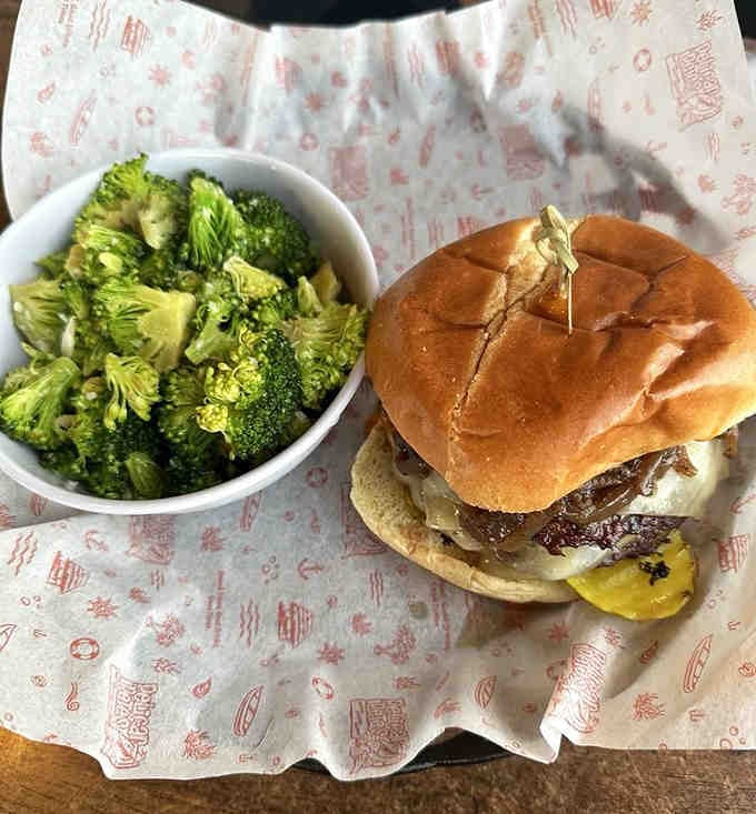 This burger comes with enough toppings to require an engineering degree and both hands to eat properly.