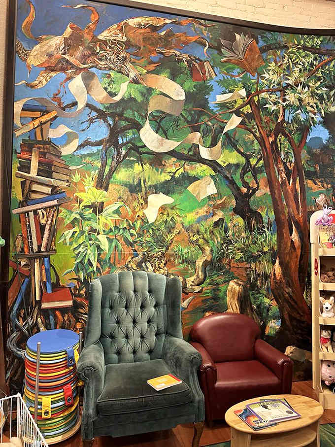 That vibrant mural transforms the children's section into a magical forest where young readers can lose themselves completely.